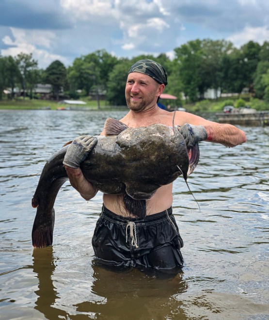 18 Wild Photos of Catfish Noodlers Wrestling Giant Flatheads | Outdoor Life